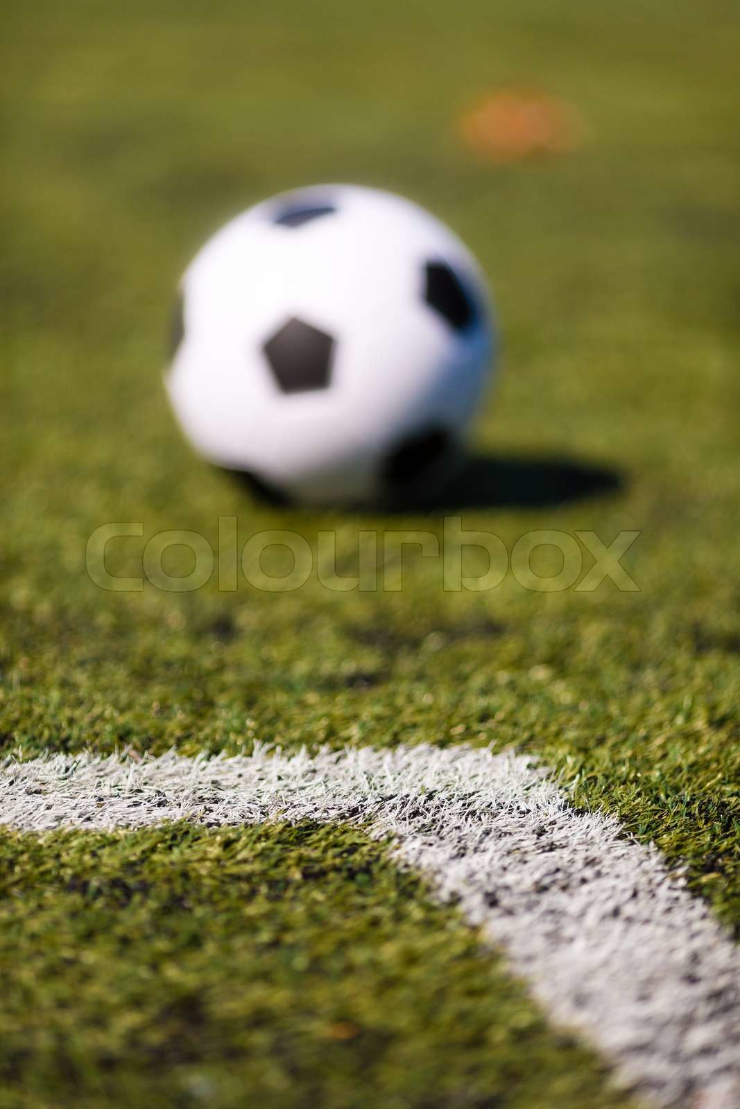 Green pitch with soccer ball | Stock image | Colourbox