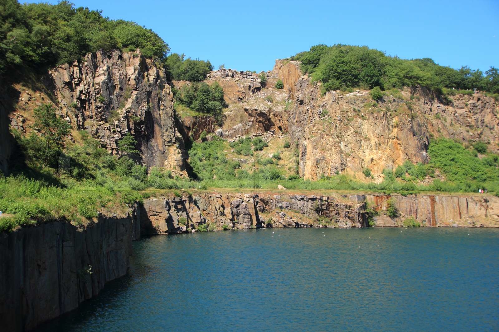 Lake with cliffs and blue sky | Stock image | Colourbox