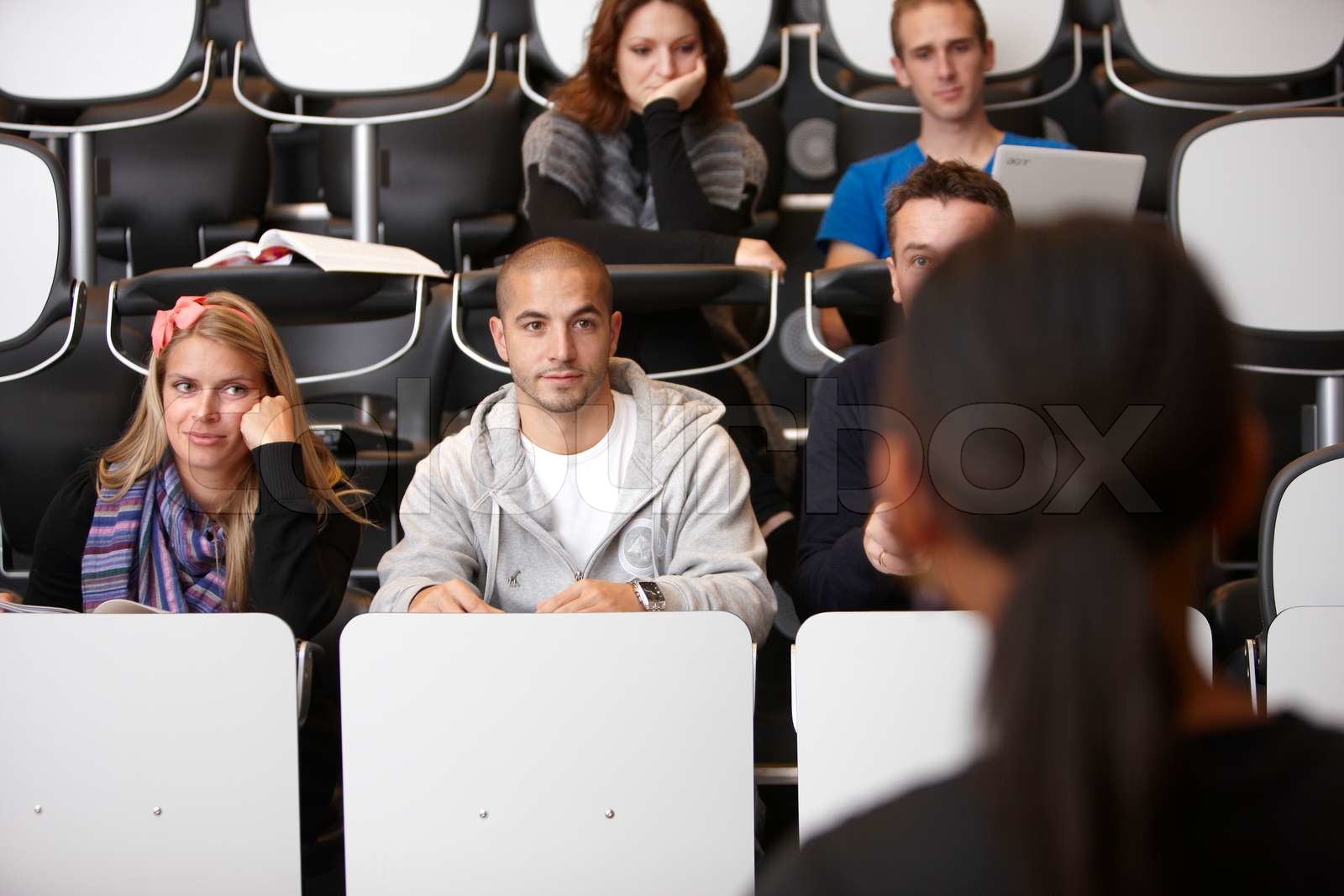 College students in an auditorium | Stock image | Colourbox