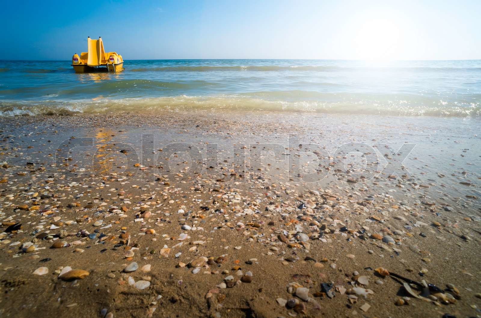 Yellow lifeboat on the beach. | Stock image | Colourbox