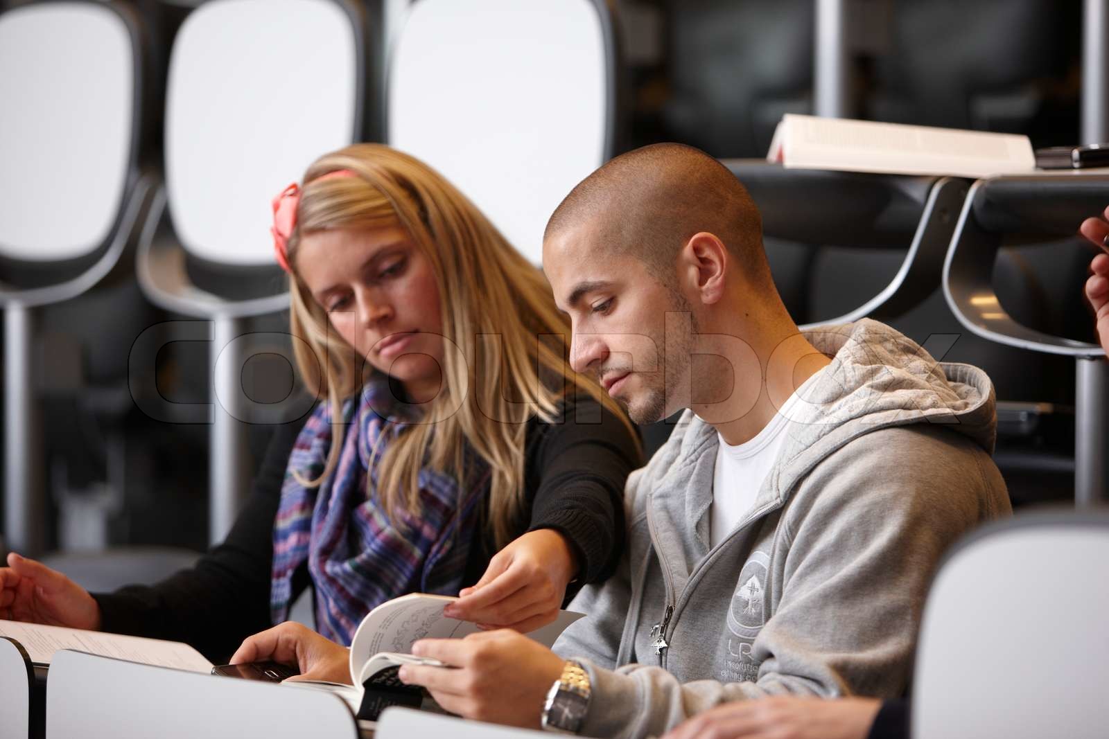 College students reading a book | Stock image | Colourbox