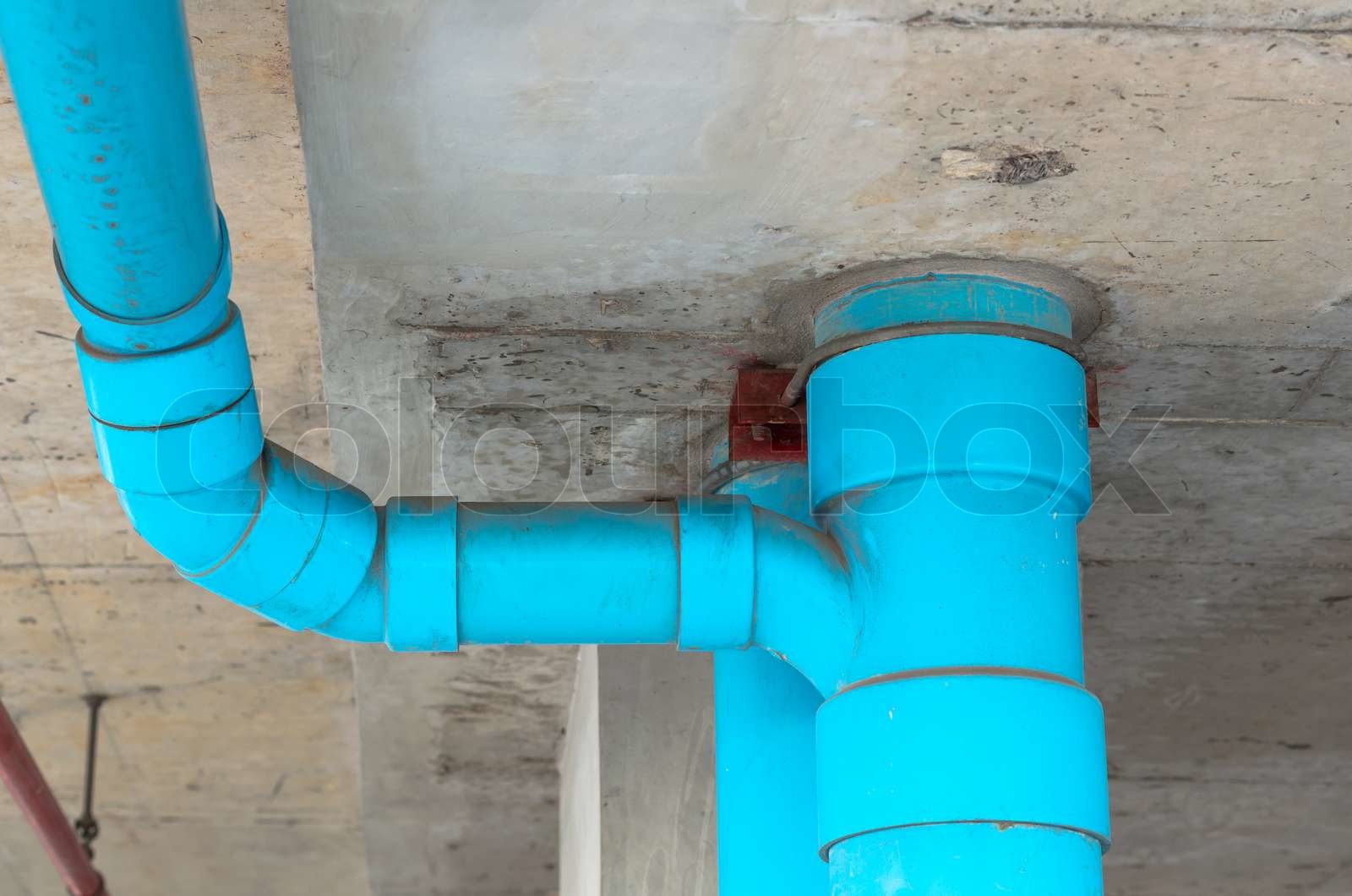 Blue PVC pipe with wall | Stock image | Colourbox