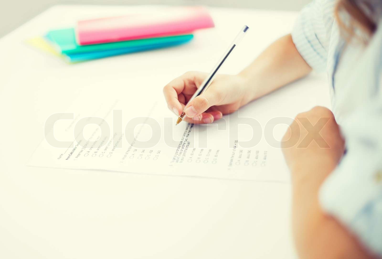 little girl taking test | Stock image | Colourbox