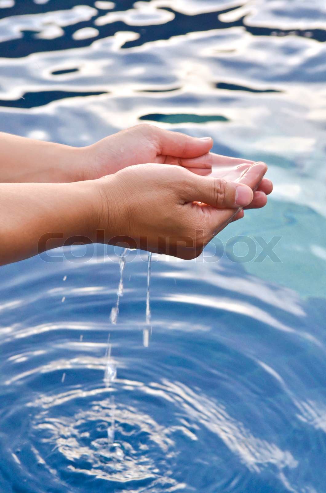Human hands with water drop | Stock image | Colourbox