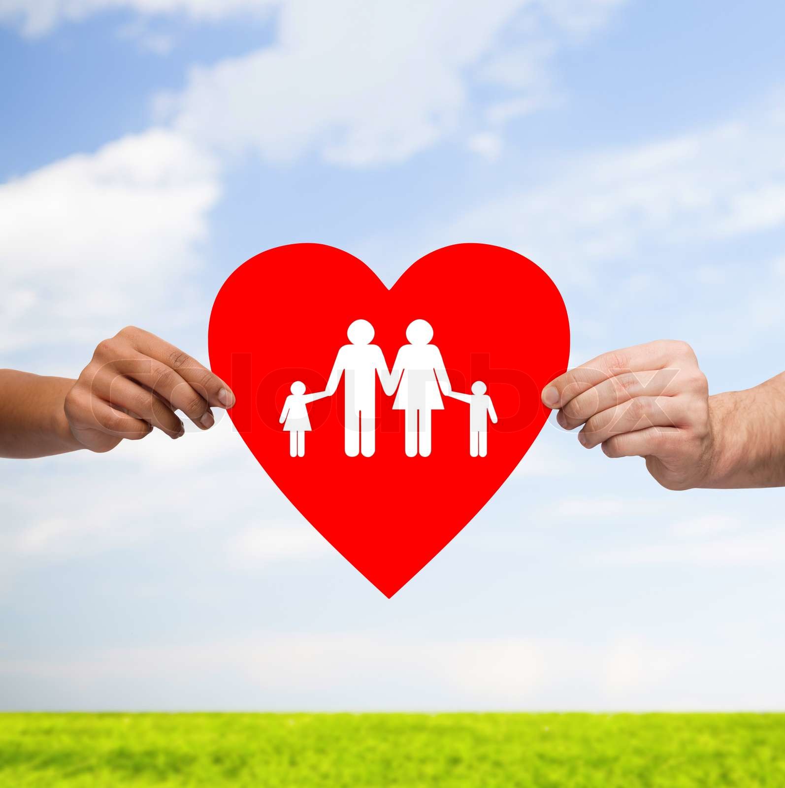 couple hands holding red heart with family | Stock image | Colourbox