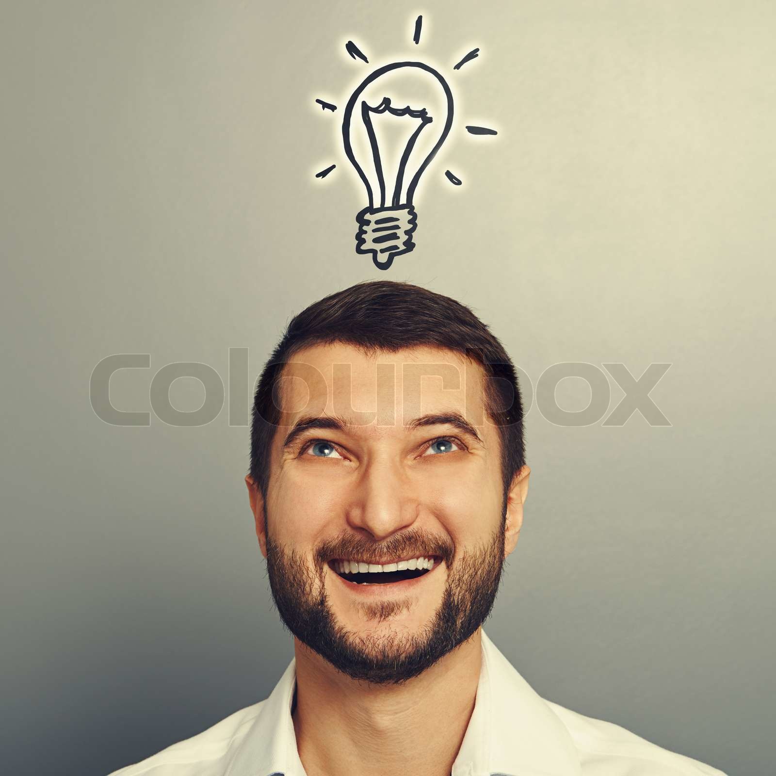 smiley young man looking up | Stock image | Colourbox
