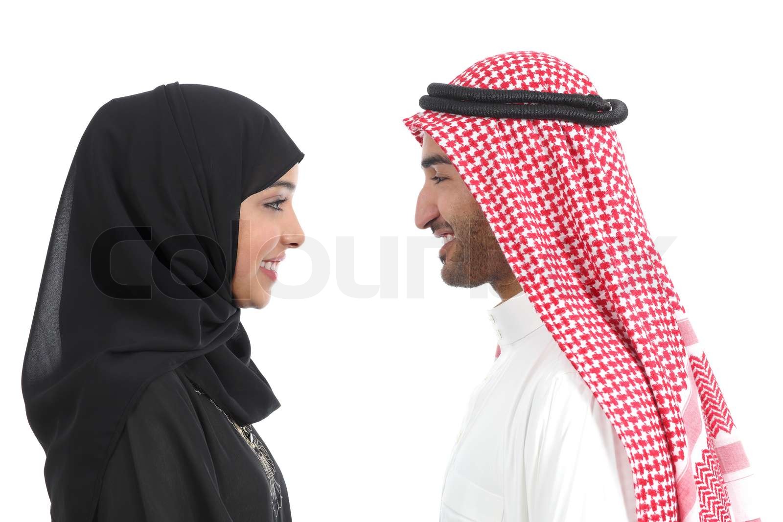 Side view of an arab saudi couple looking each other | Stock image ...