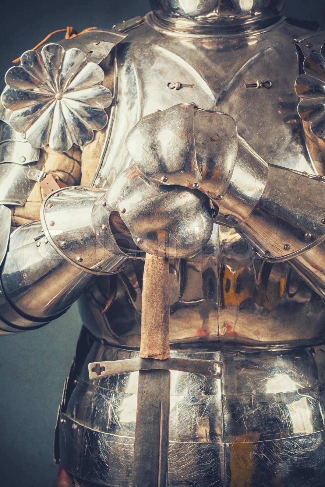 knight wearing armor and standing with two-handed sword | Stock image ...