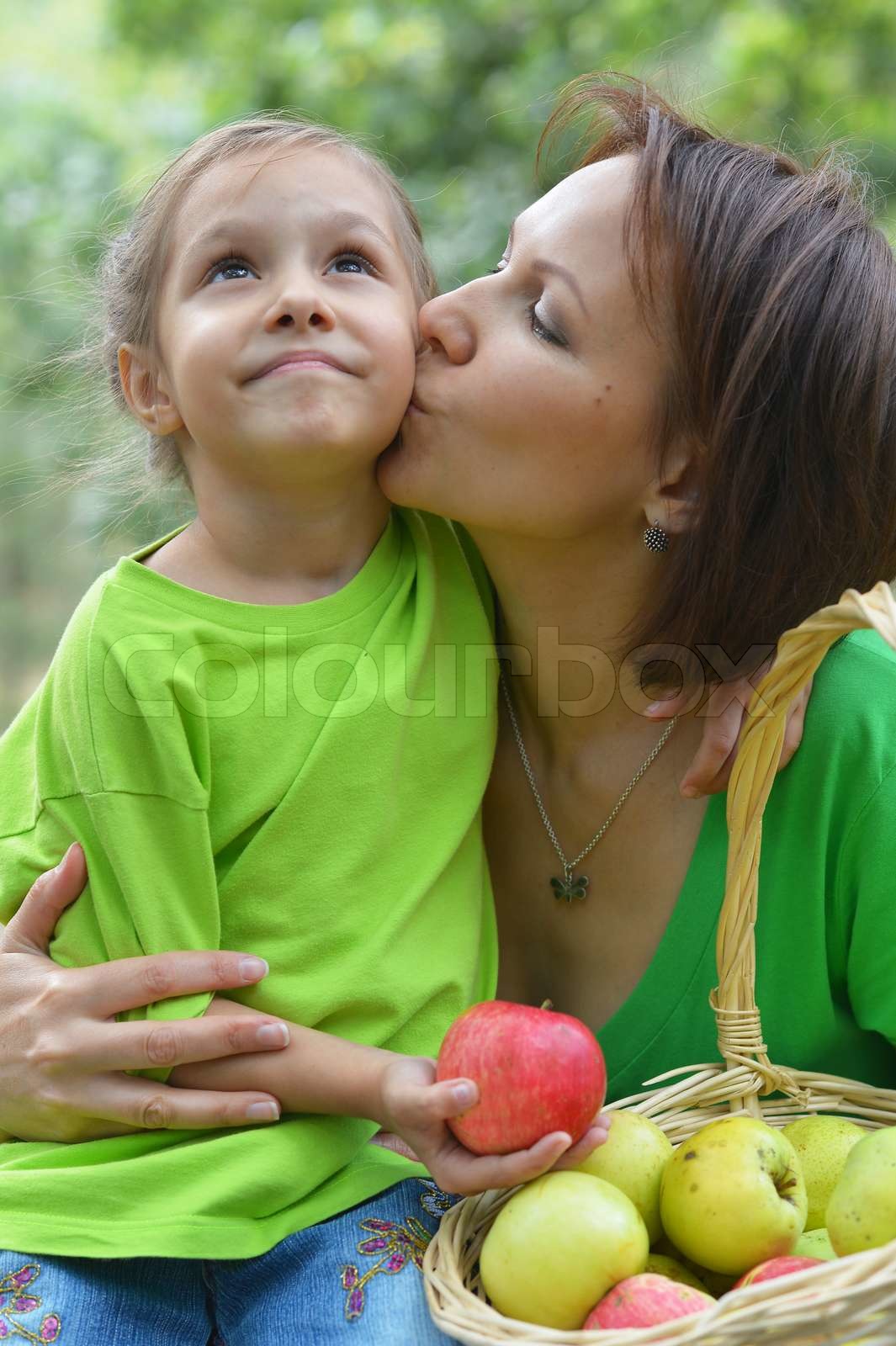 Mother And Her Daughter Eating Stock Image Colourbox