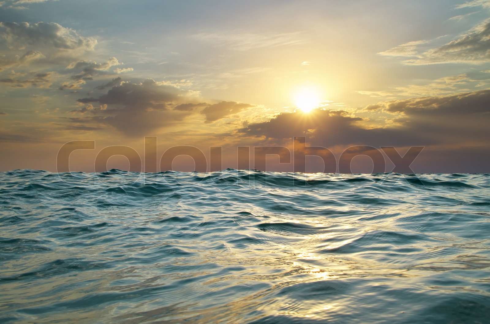 Wave on sunset. | Stock image | Colourbox