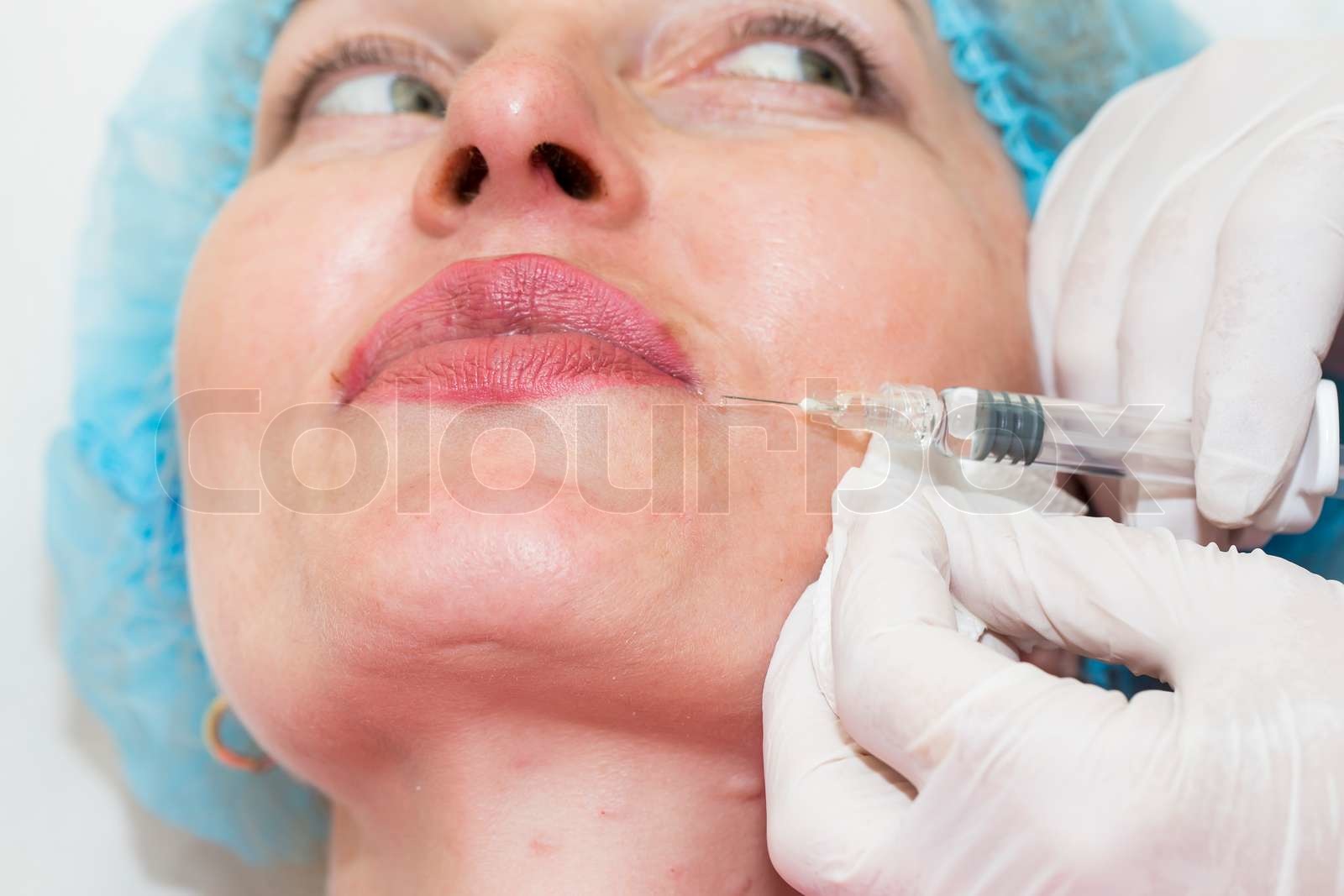 Cosmetic treatment with injection in a clinic | Stock image | Colourbox