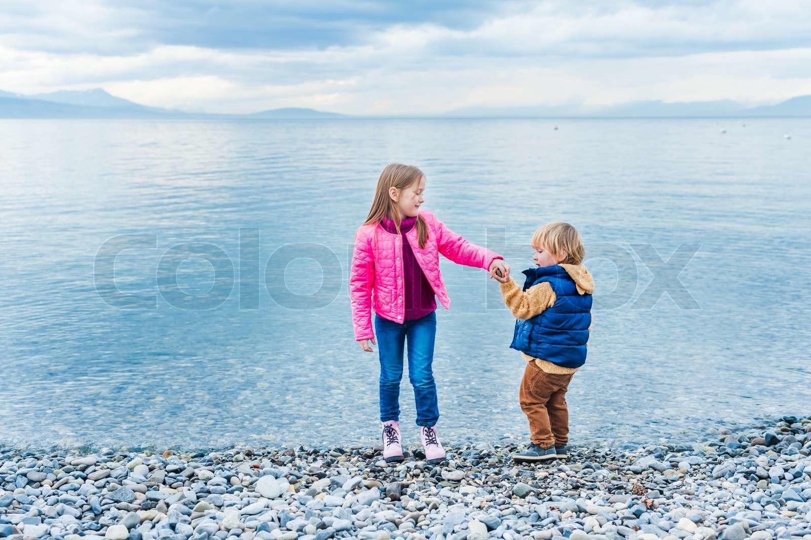 Adorable children playing together outdoors | Stock image | Colourbox