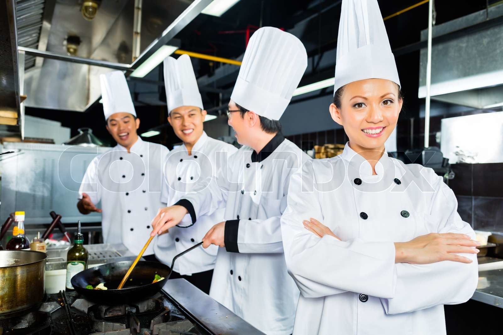 Asian Chefs in hotel restaurant kitchen | Stock image | Colourbox