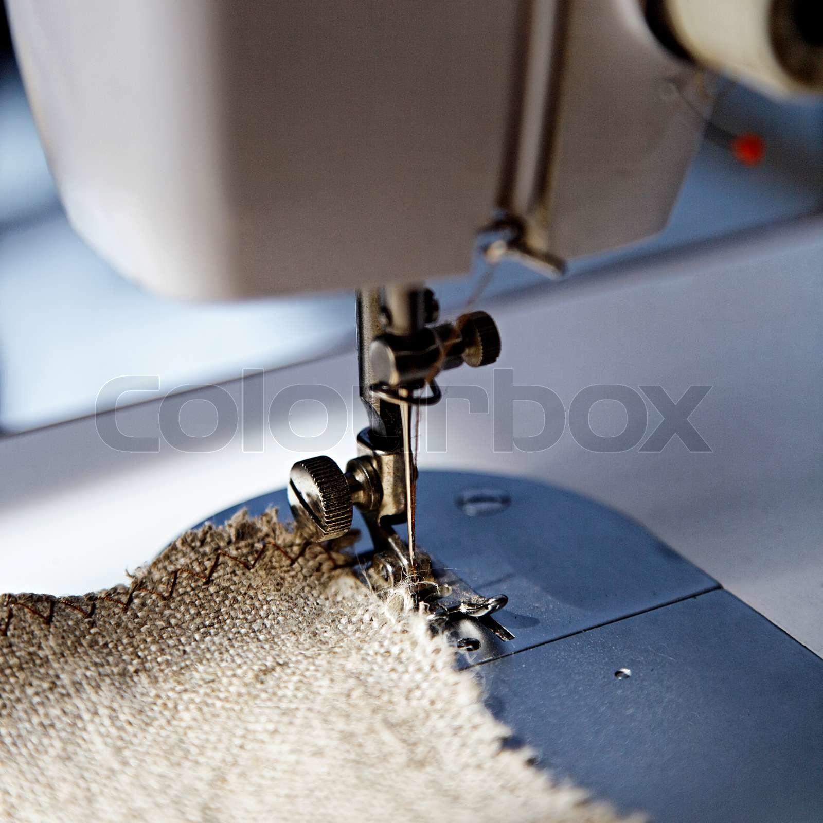 Sewing machine working part with cloth. | Stock image | Colourbox