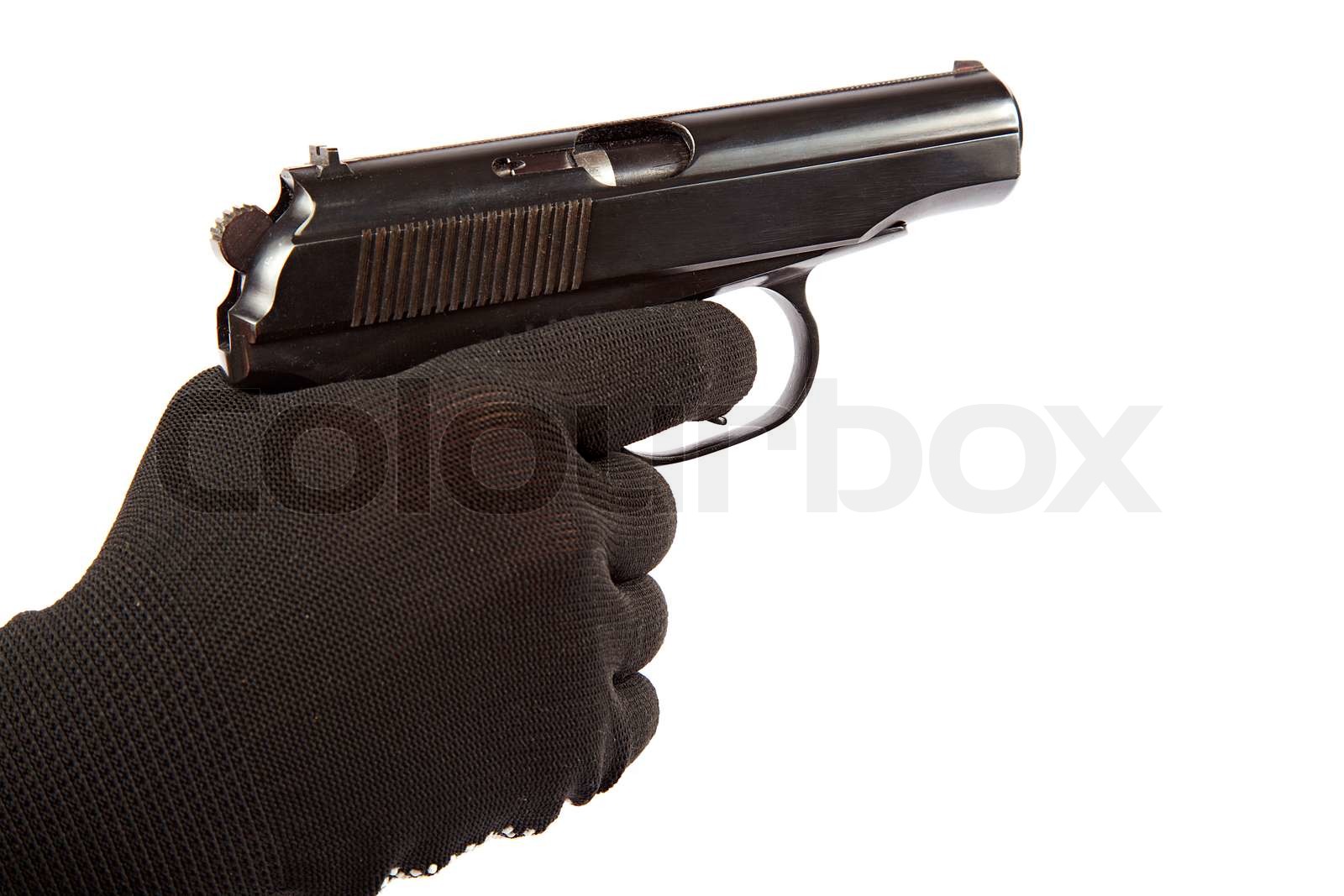 Waffe in der Hand mit schwarzen Handschuhen. | Stock Bild | Colourbox