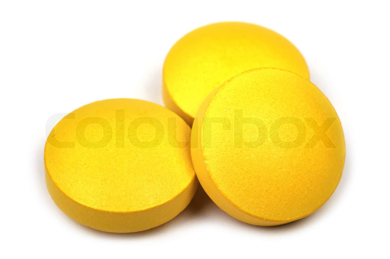 three yellow tablets | Stock image | Colourbox
