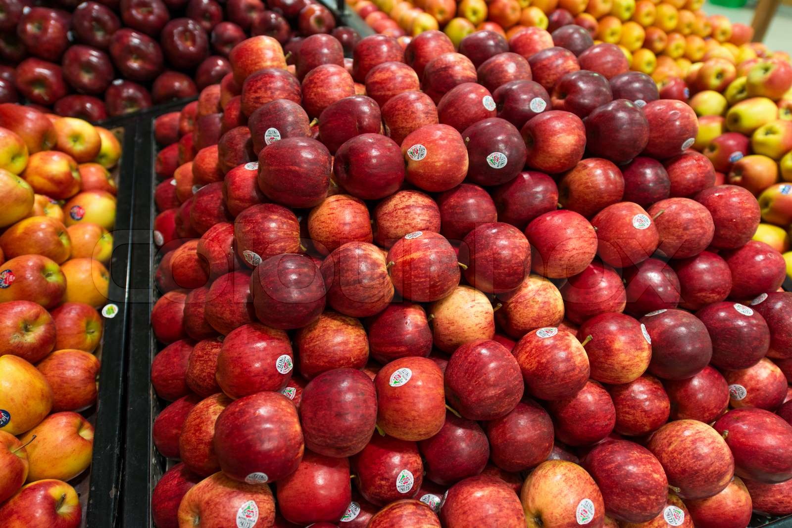 Apple stall in big supermarket | Stock image | Colourbox