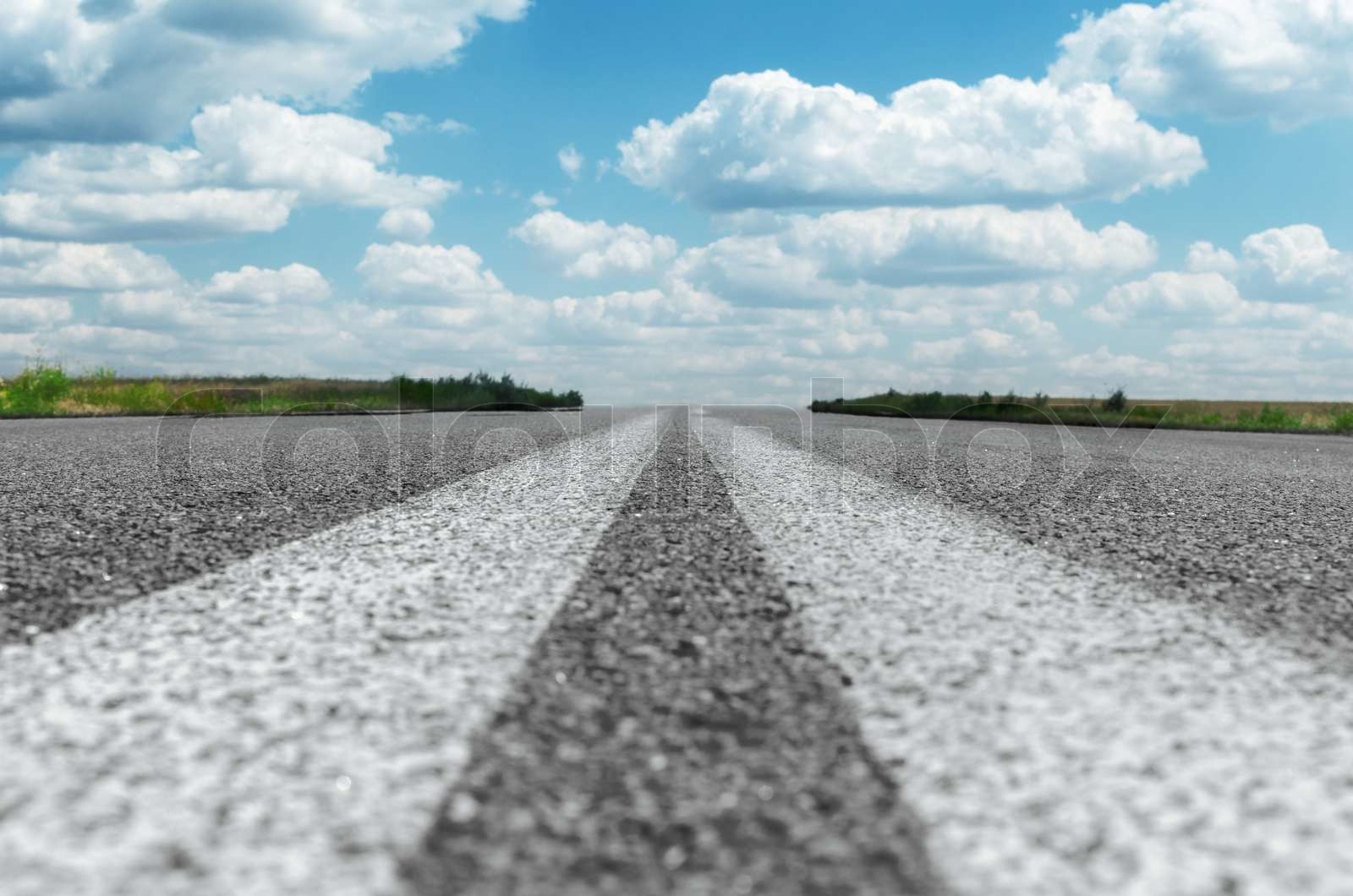 two solid white lines on asphalt road | Stock image | Colourbox