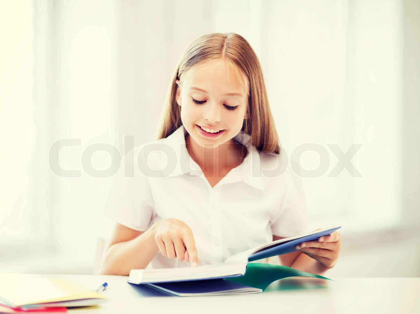 student girl studying at school | Stock image | Colourbox