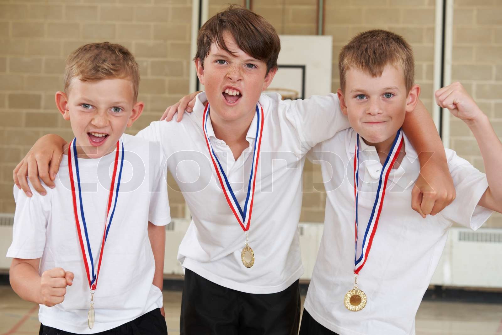 Male School Sports Team In Gym With Medals | Stock image | Colourbox