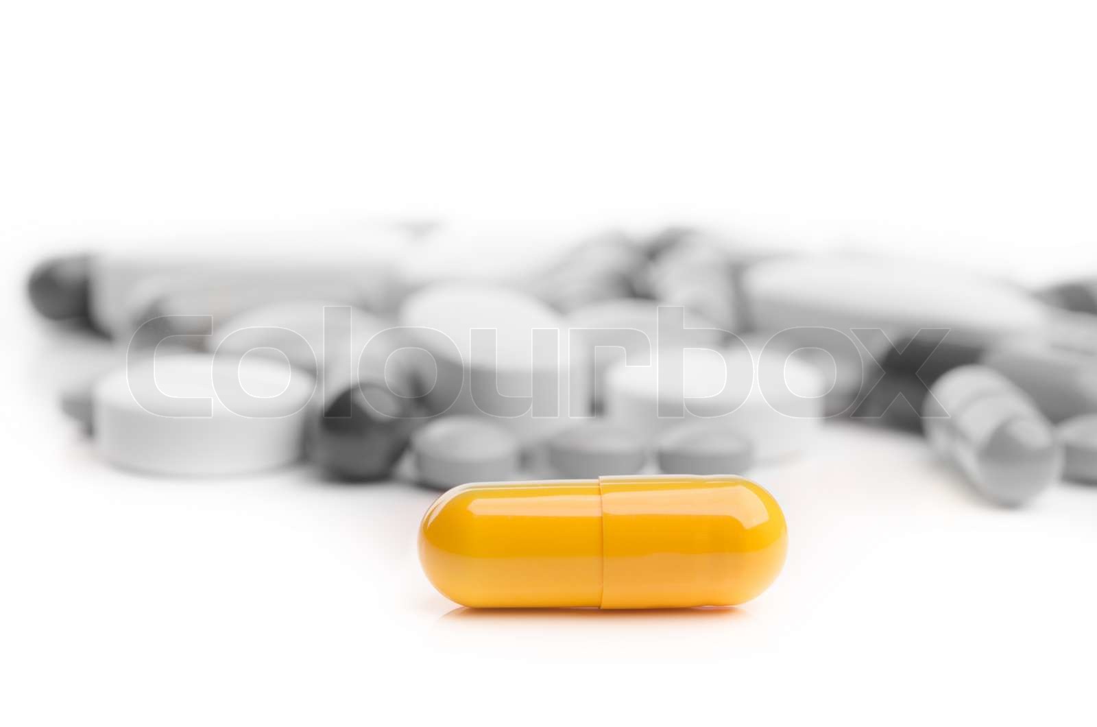 yellow pill capsule | Stock image | Colourbox