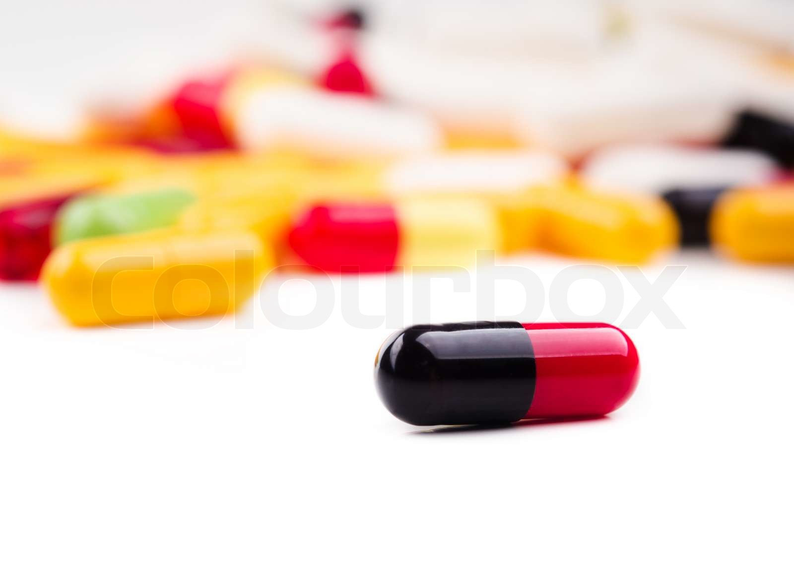 red black pill capsule | Stock image | Colourbox