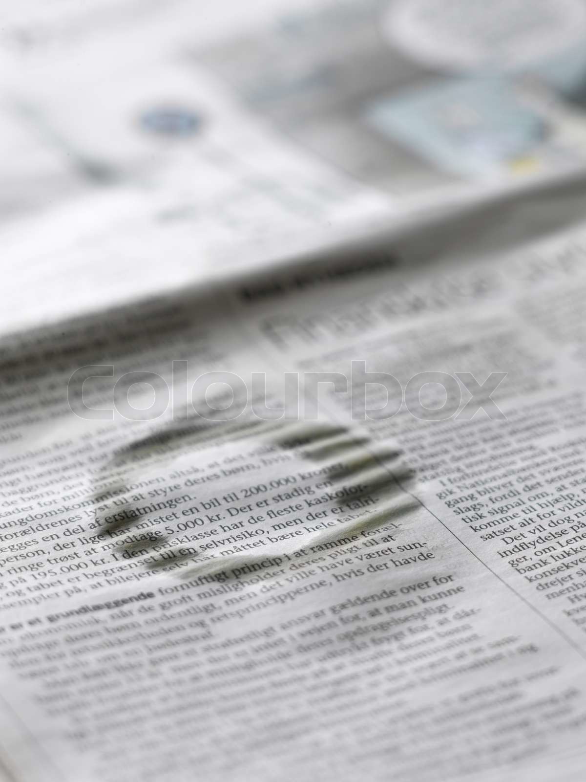 Water stain on a newspaper | Stock image | Colourbox