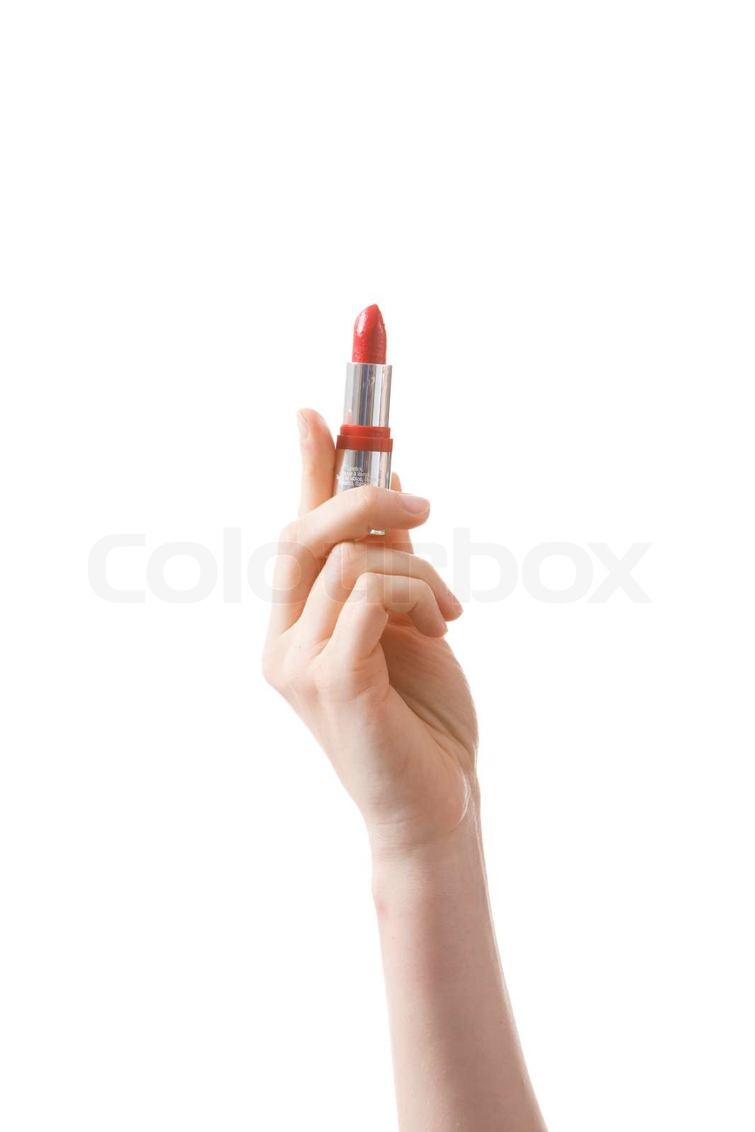 Hand holding a lipstick | Stock image | Colourbox