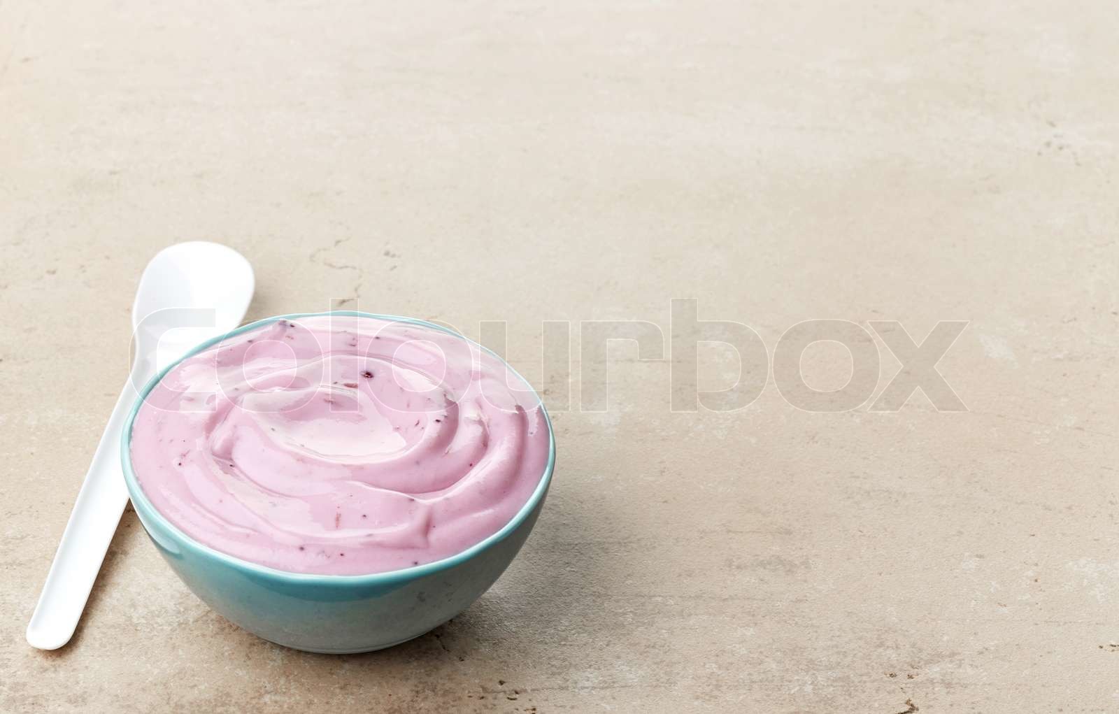 bowl of pink fruit yogurt | Stock image | Colourbox
