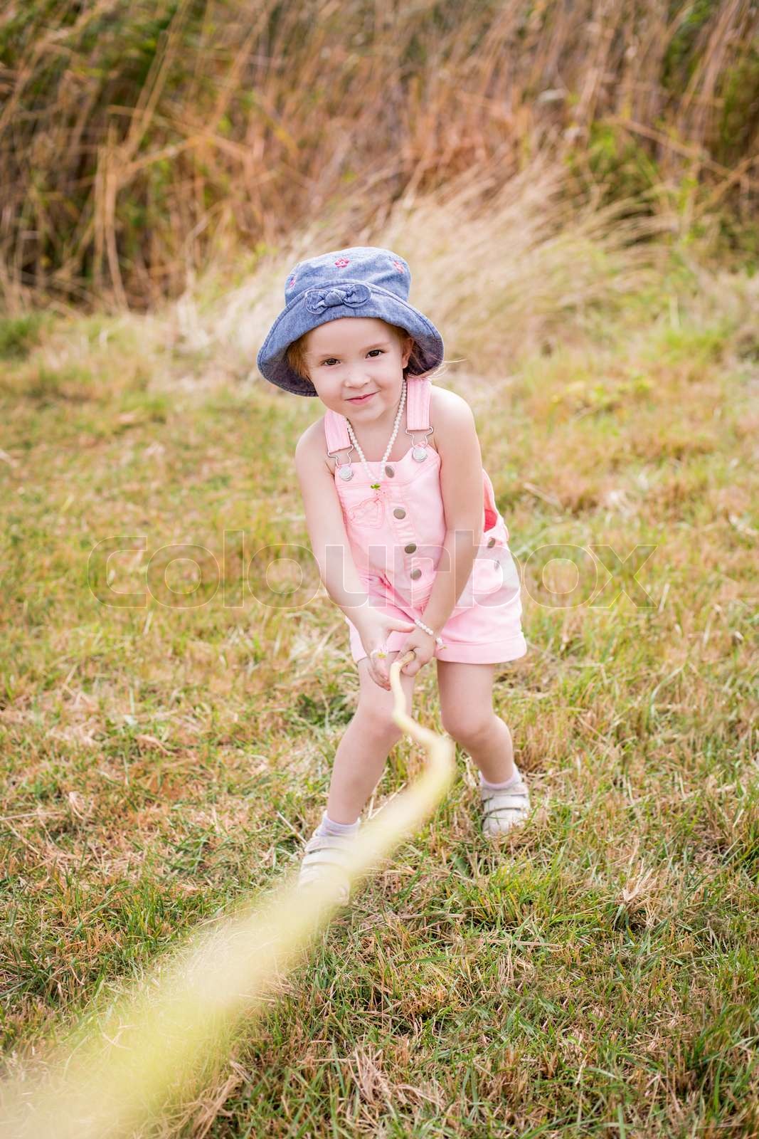happy little girl playing | Stock image | Colourbox