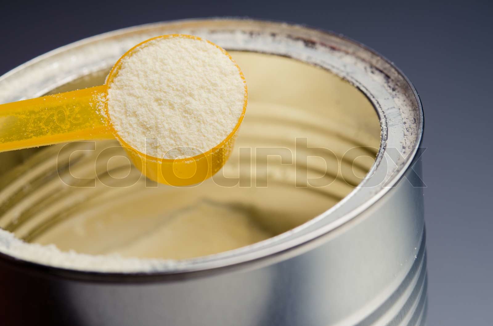 spoon with infant formula | Stock image | Colourbox