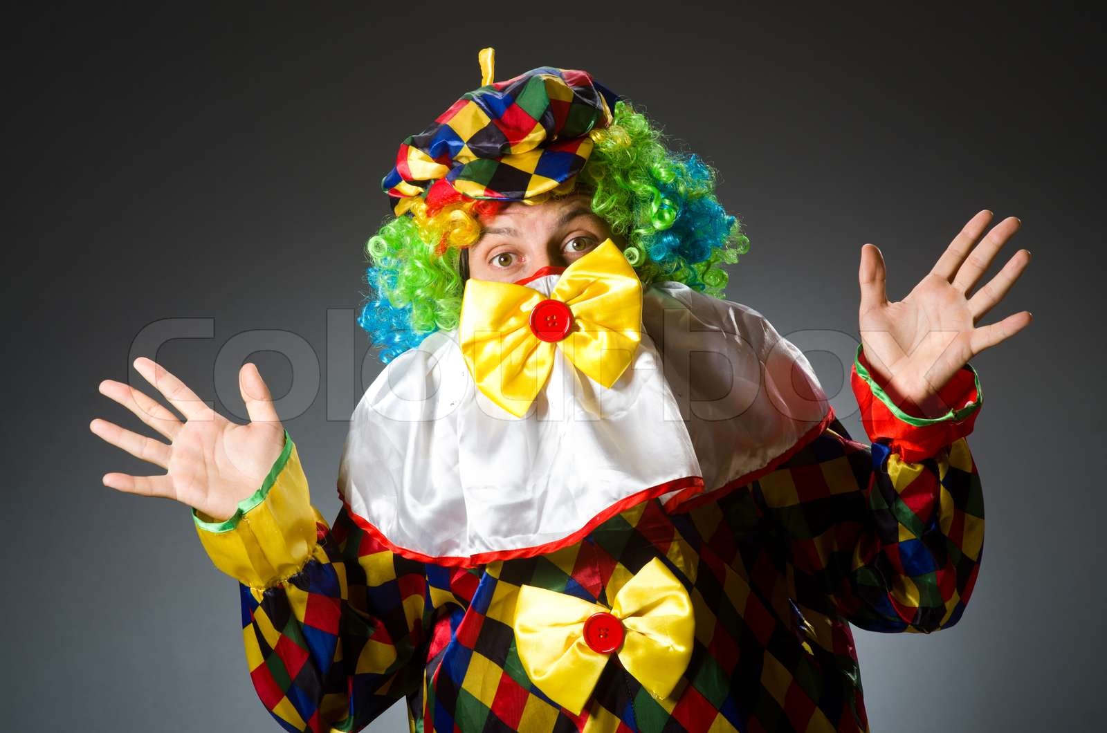 Funny clown in colourful costume | Stock image | Colourbox