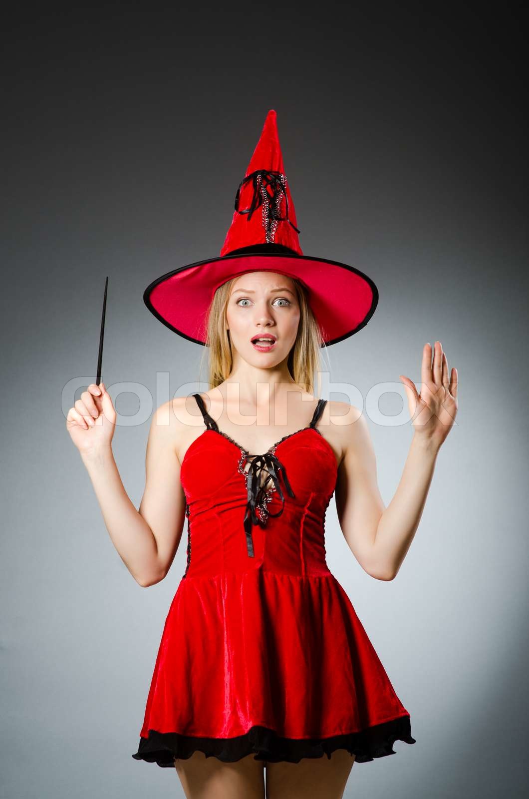 Woman magician doing her tricks with wand | Stock image | Colourbox