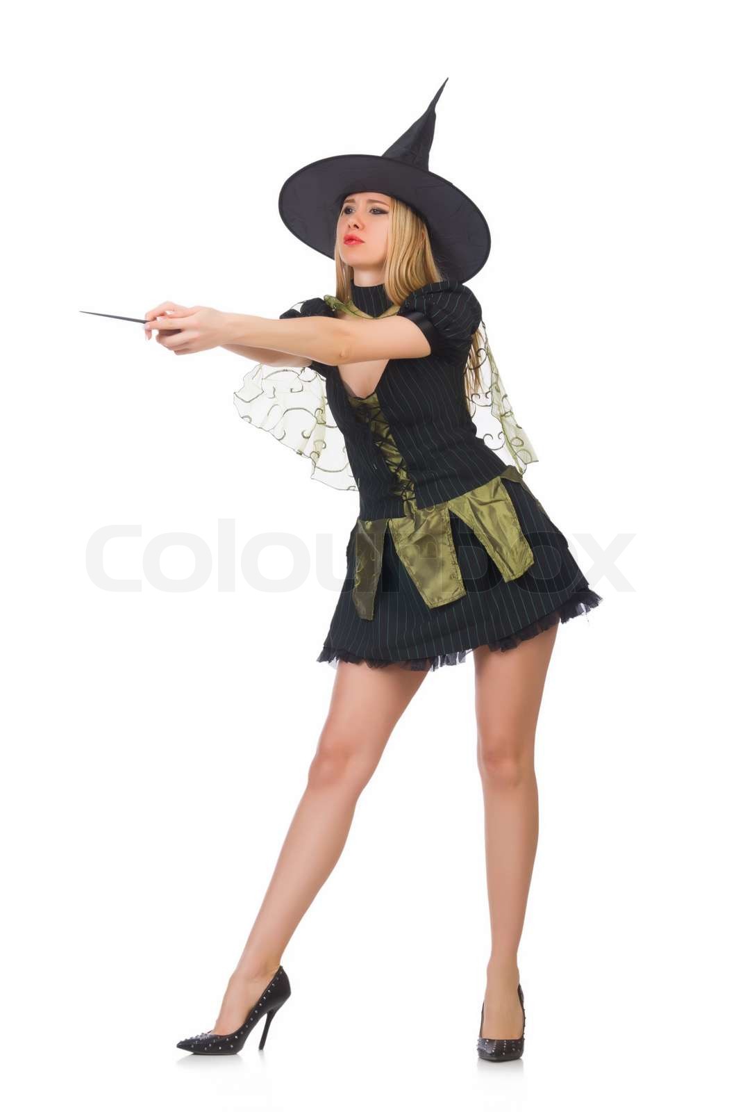 Woman magician doing her tricks with wand | Stock image | Colourbox