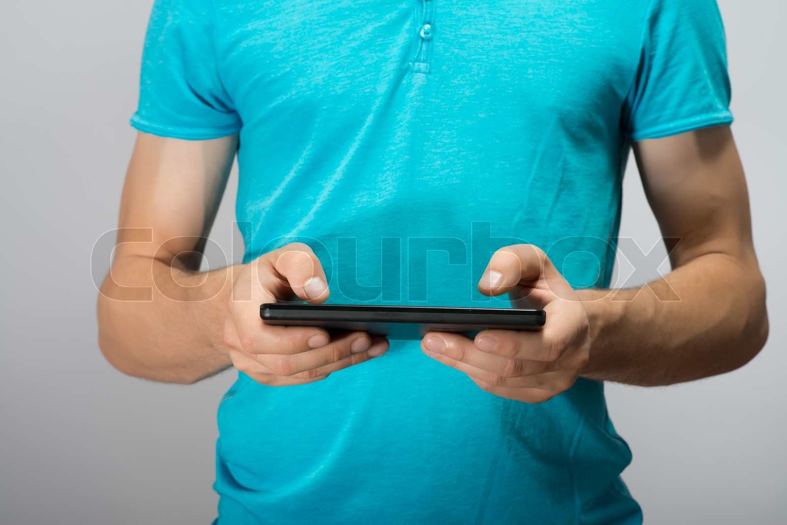 man holding digital tablet, closeup | Stock image | Colourbox
