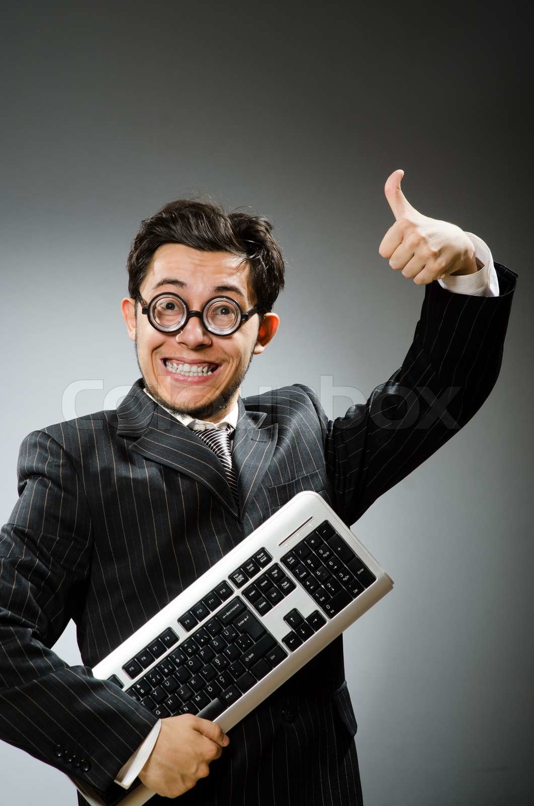 Comouter geek with computer keyboard | Stock image | Colourbox
