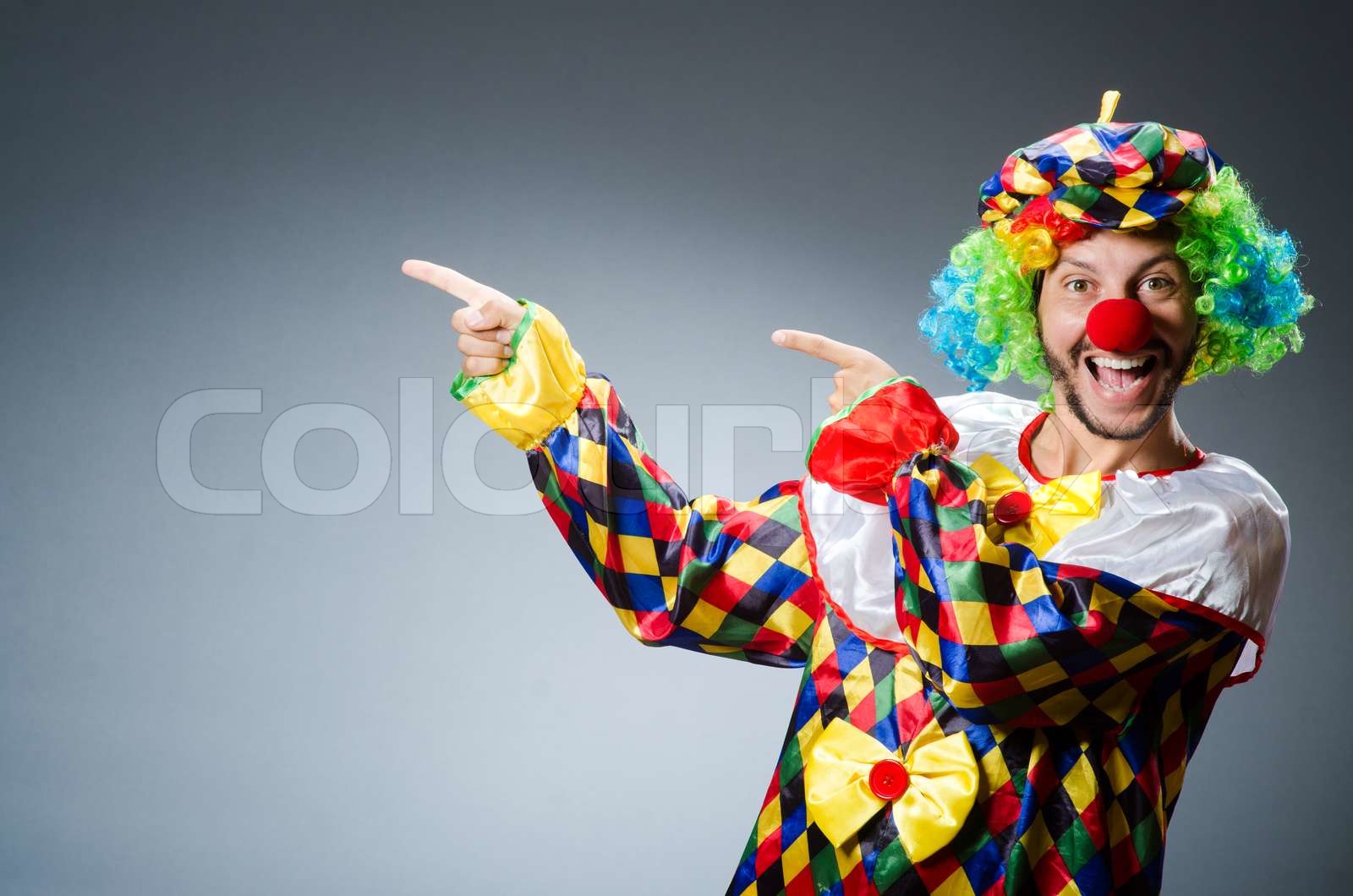 Funny clown in colourful costume | Stock image | Colourbox