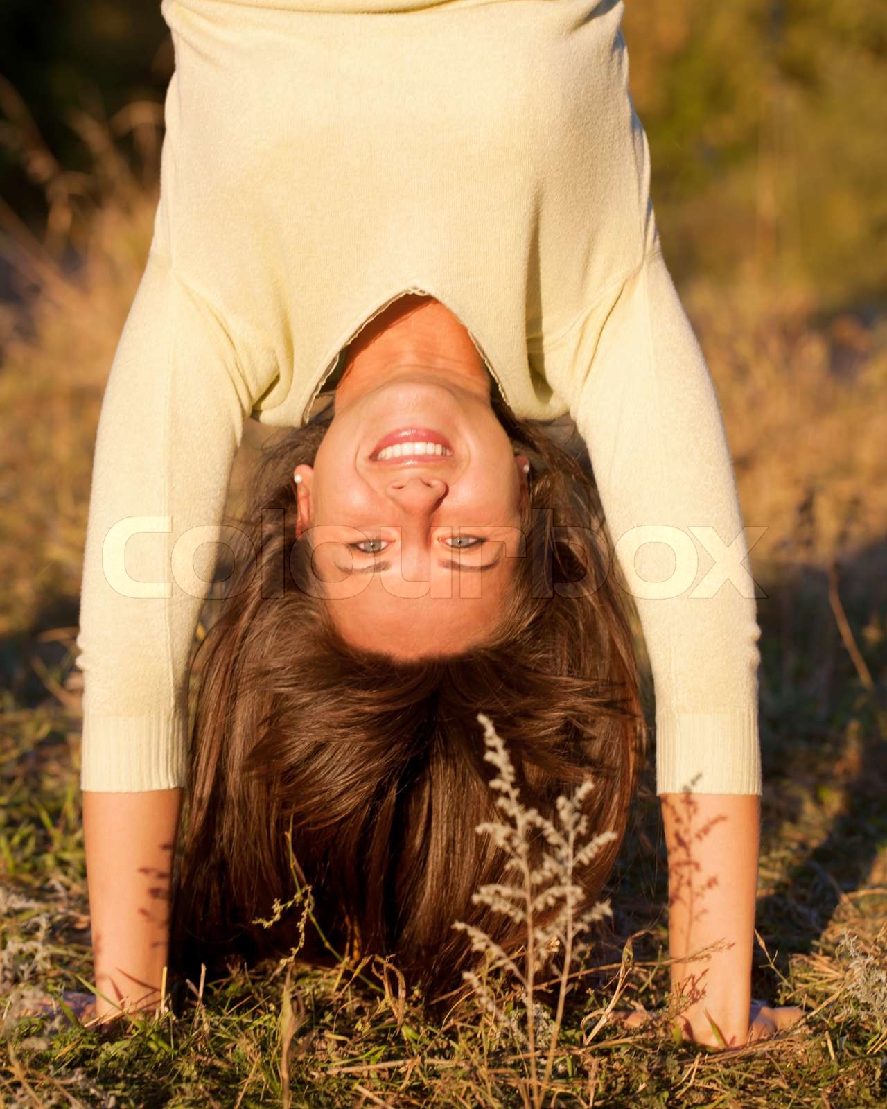 woman standing on head upside down | Stock image | Colourbox