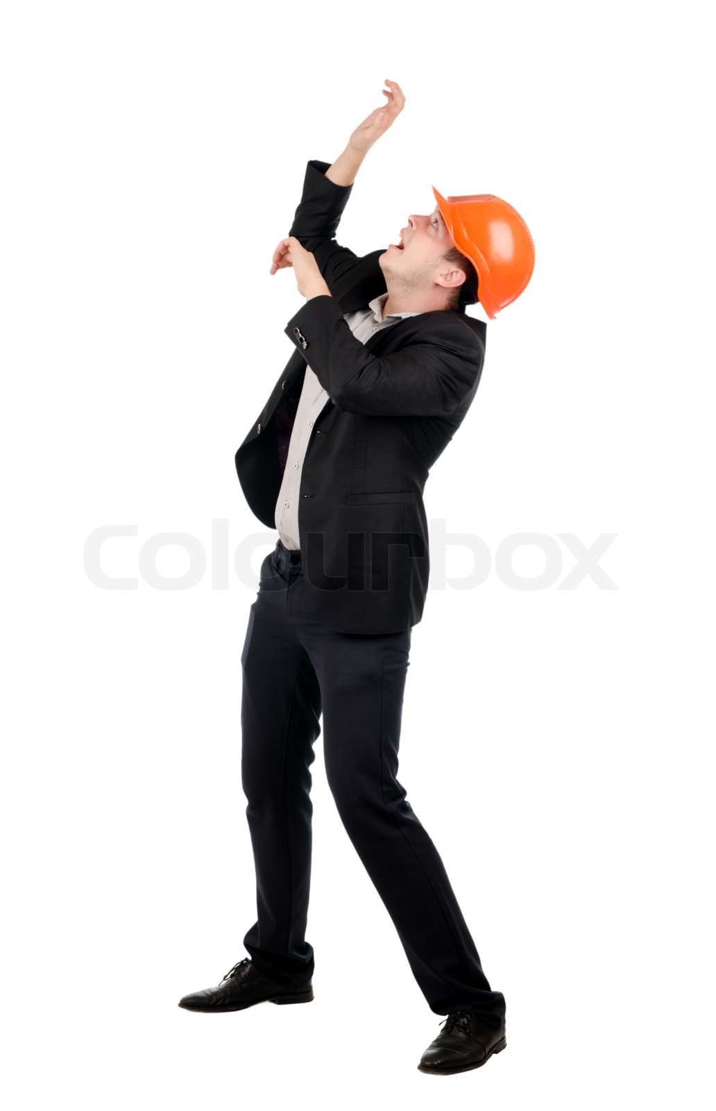 Cowering Man Wearing Suit and Hard Hat | Stock image | Colourbox