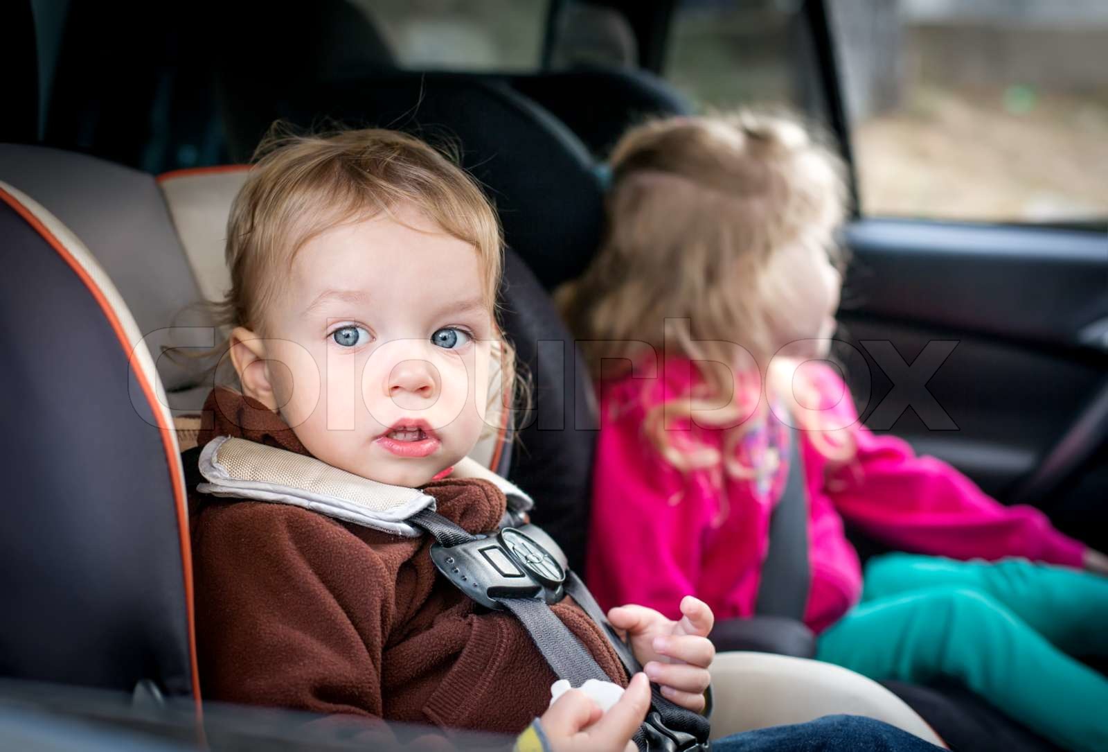 small children in the car | Stock image | Colourbox