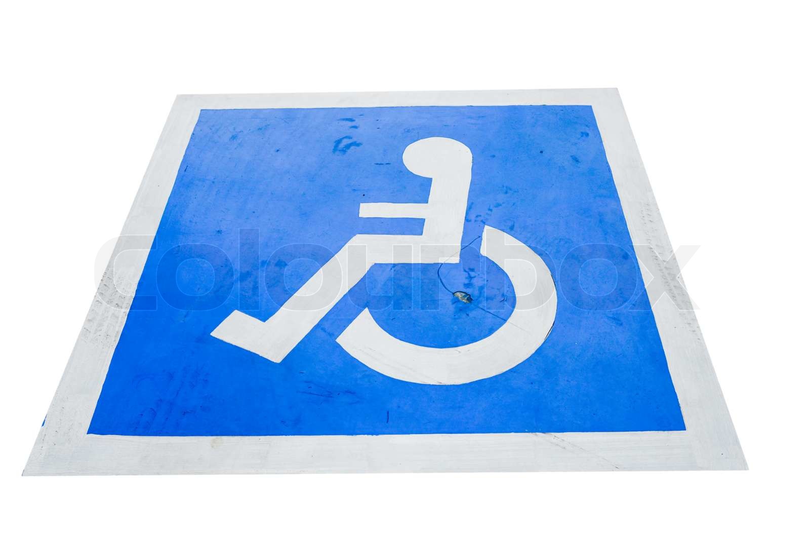 International handicapped symbol painted in bright blue isolated on ...