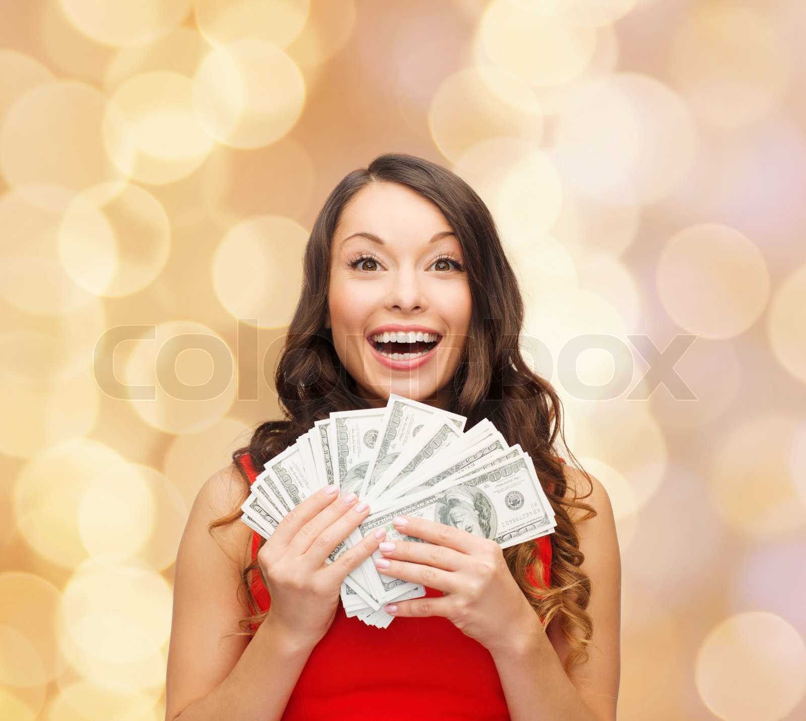 woman in red dress with us dollar money | Stock image | Colourbox
