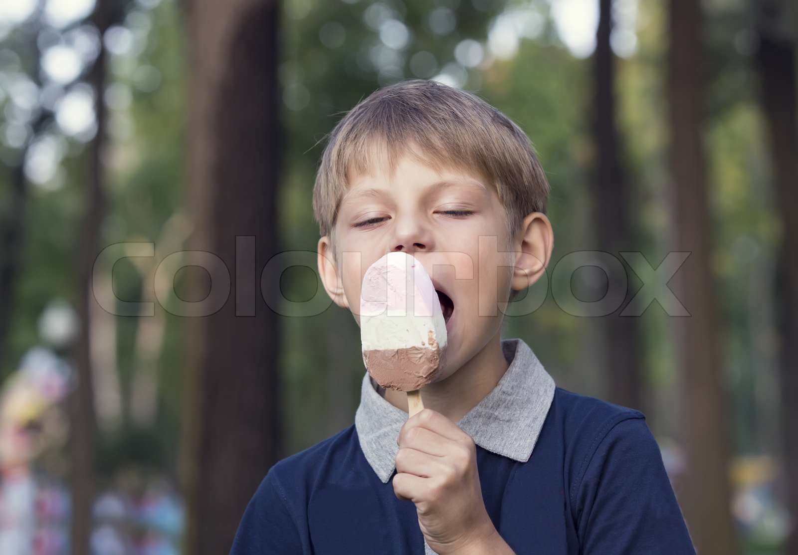 little boy eating an ice cream | Stock image | Colourbox