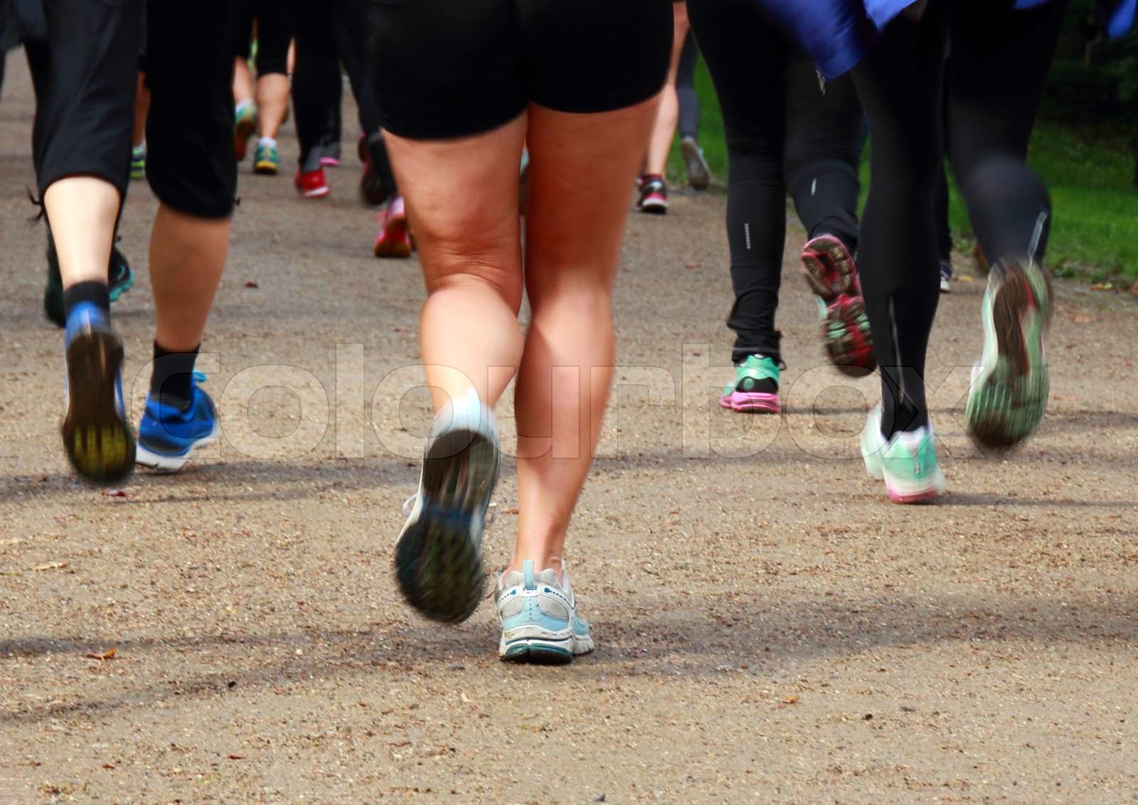 Running rearguard of legs at a long distance race | Stock image | Colourbox
