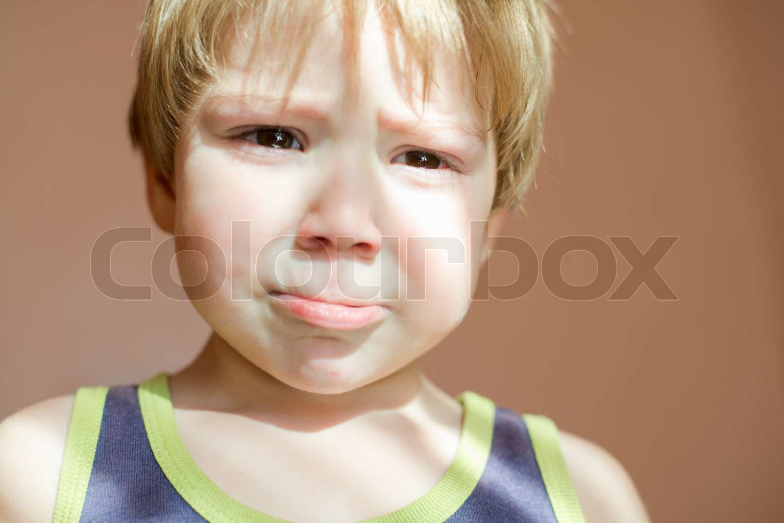 Little boy is not happy and waiting for punishment from parent | Stock ...