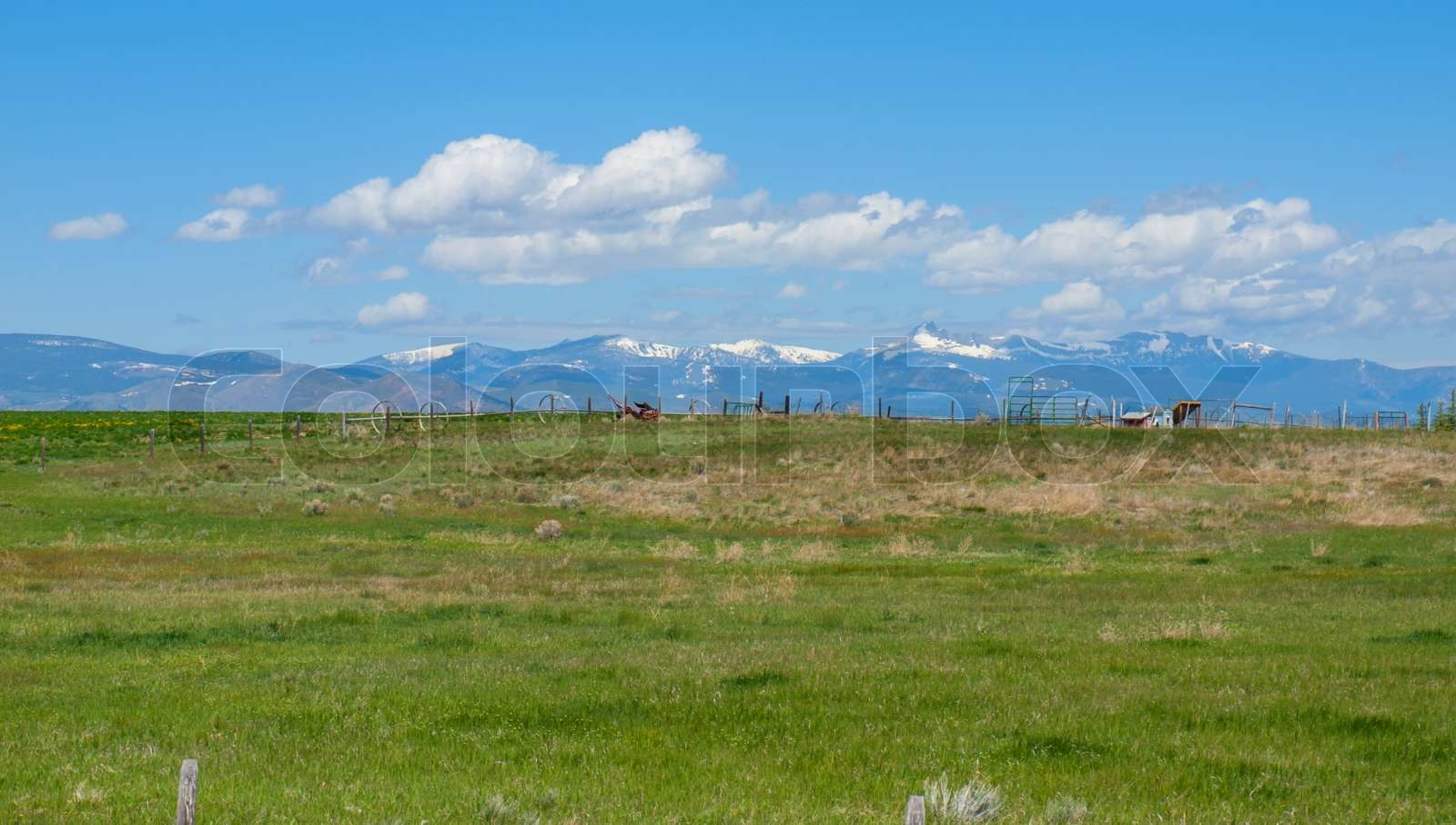 A Country Scene of Fields, Hills, and Mountains in Montana USA | Stock ...