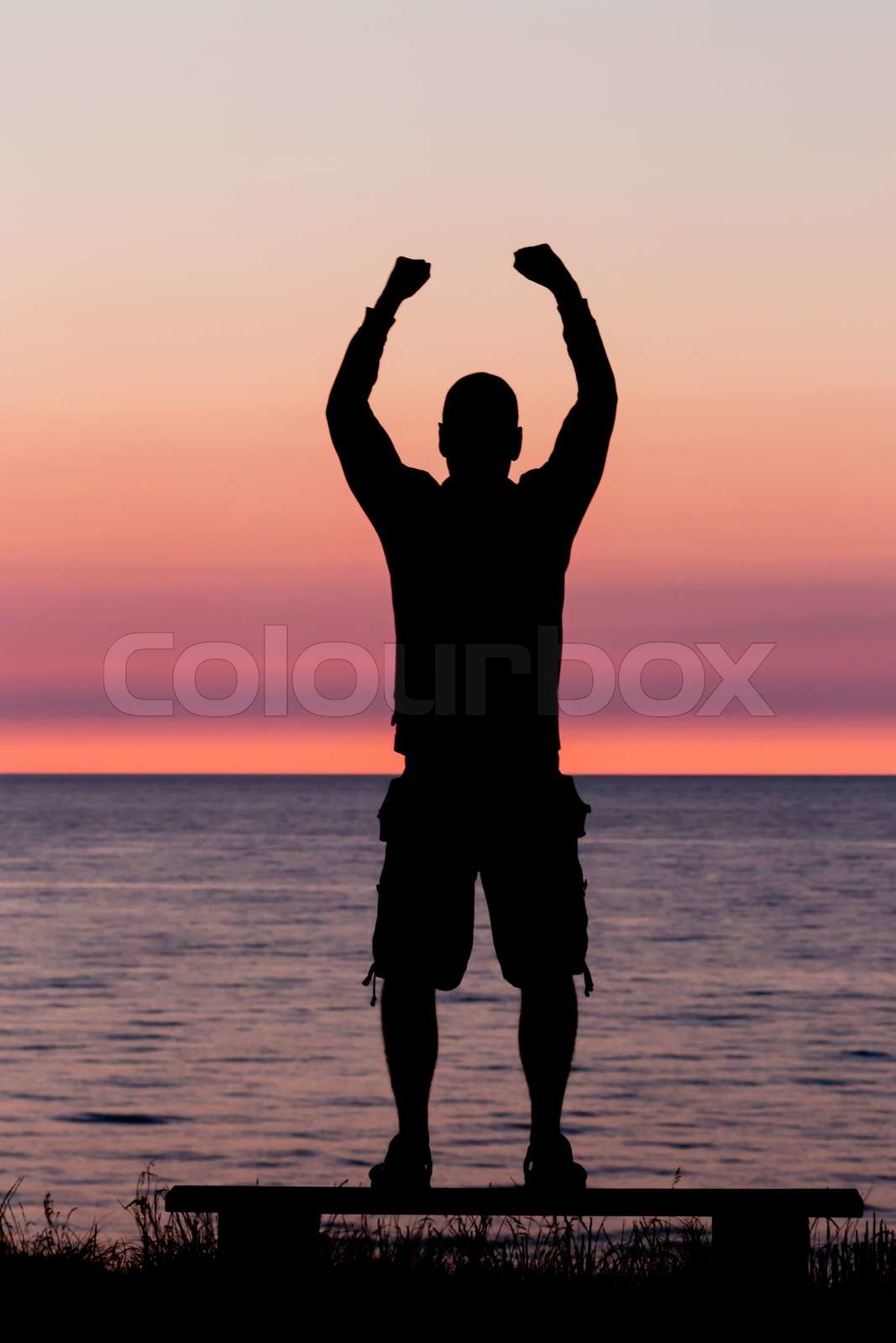 Man with raised arms | Stock image | Colourbox