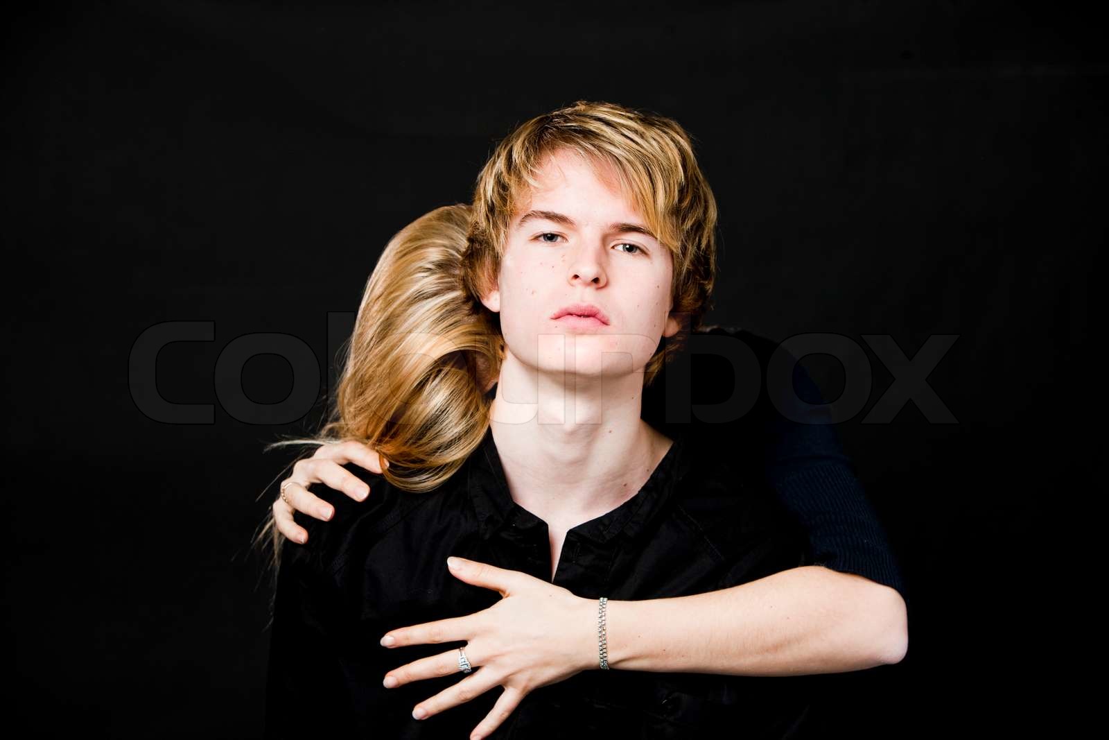 Portrait - teenage caucasian boy and his girlfriend around him | Stock ...