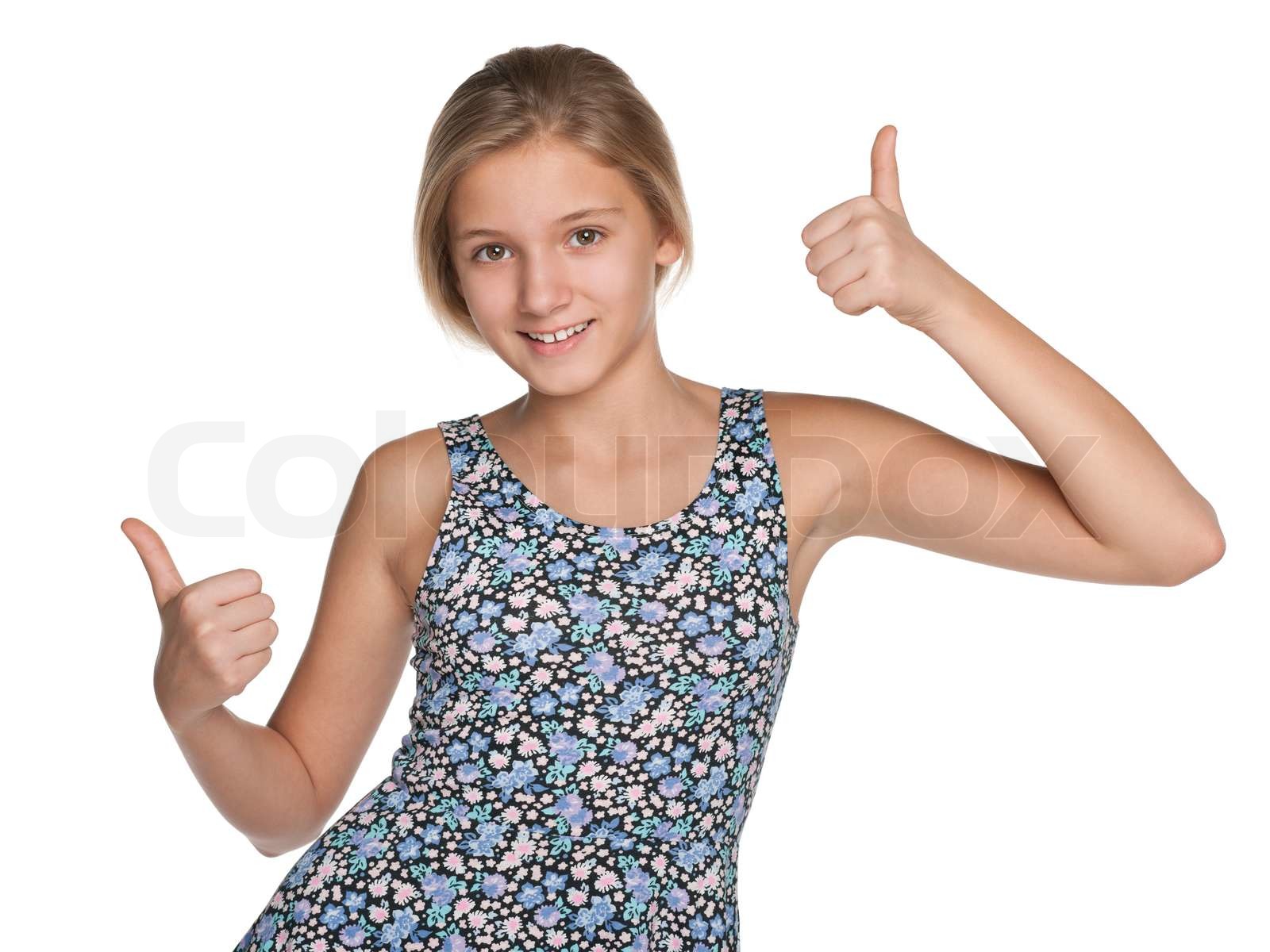 Preteen girl holds her thumbs up | Stock image | Colourbox