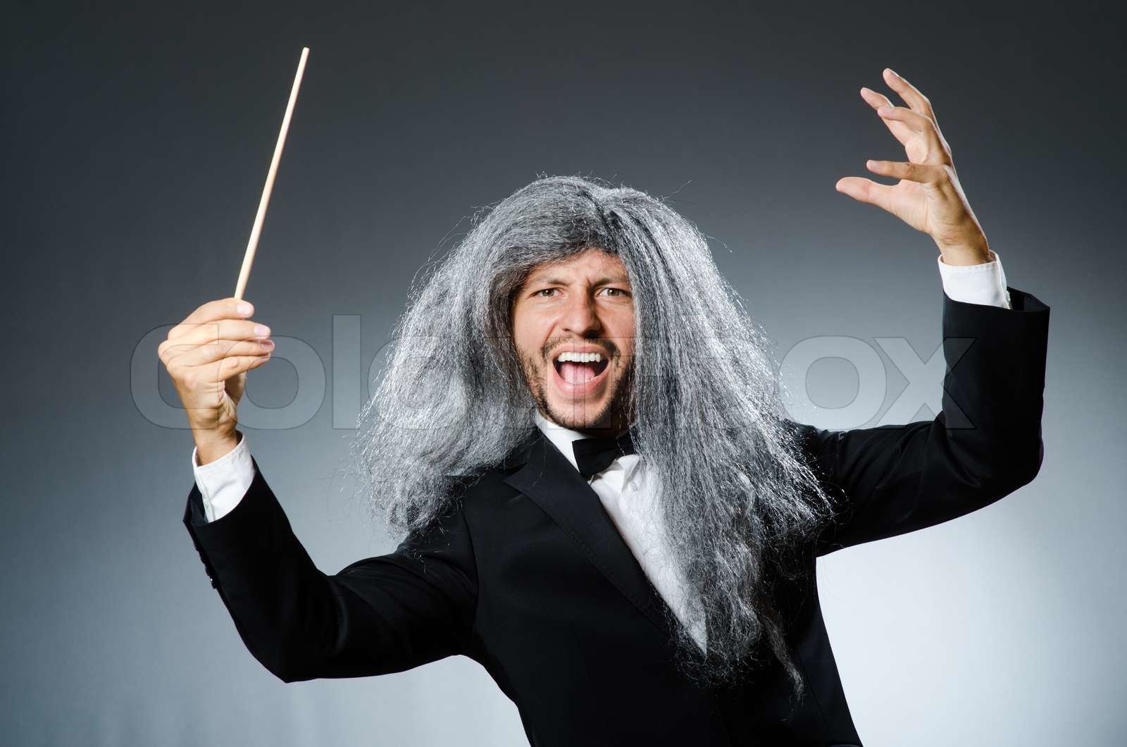 Funny conductor with long grey hair | Stock image | Colourbox